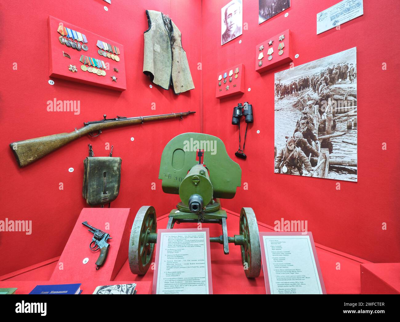 A display of Great Patriotic War objects, including medals, a rifle ...