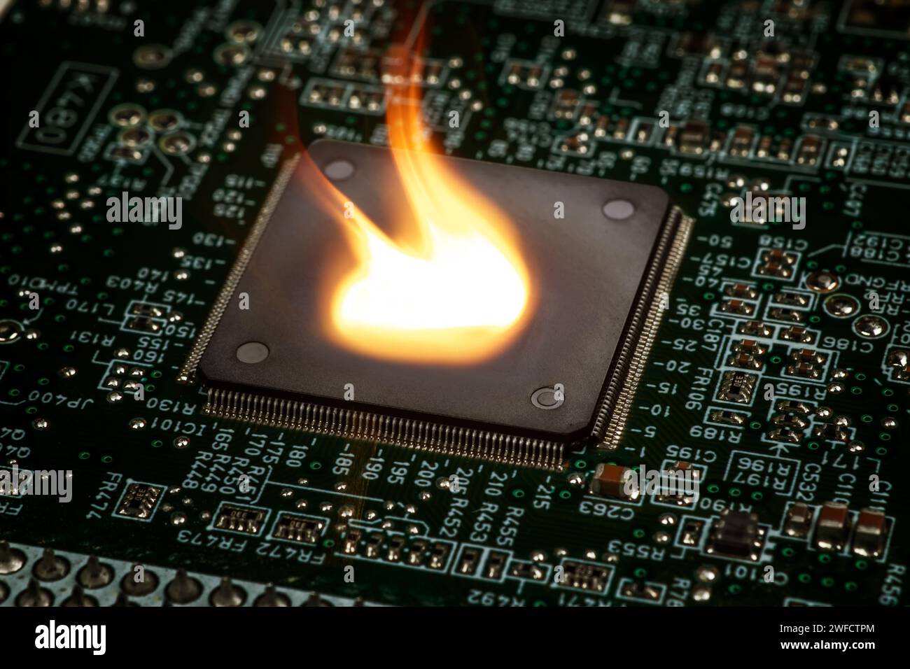 Fire burning micro chip on circuit board with electronic Stock Photo ...