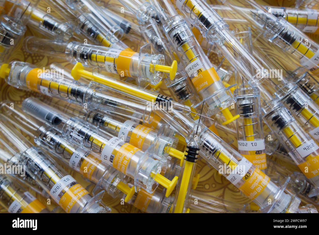 Closeup of discarded Enoxaparin Arovi Biotech plastic syringe cases and ...