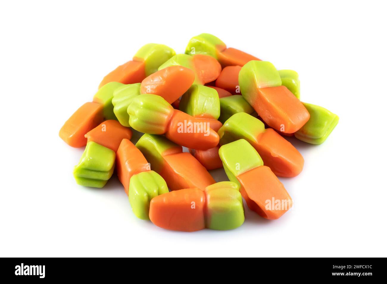 jelly carrots candies on a white background. Colorful fruit gum candies ...