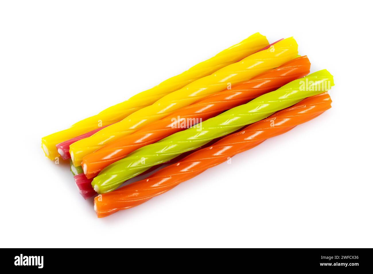 Multicolored jelly candies in the shape of the sticks on a white ...