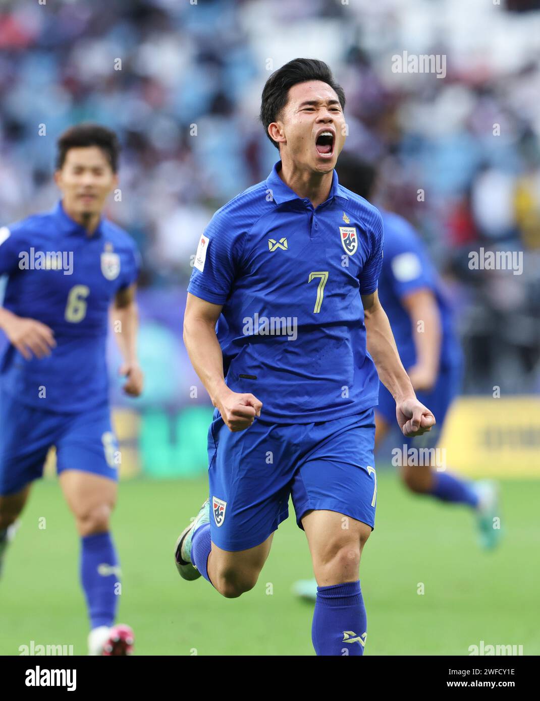 Doha, Qatar. 30th Jan, 2024. Thailand's Supachok Sarachat (R ...