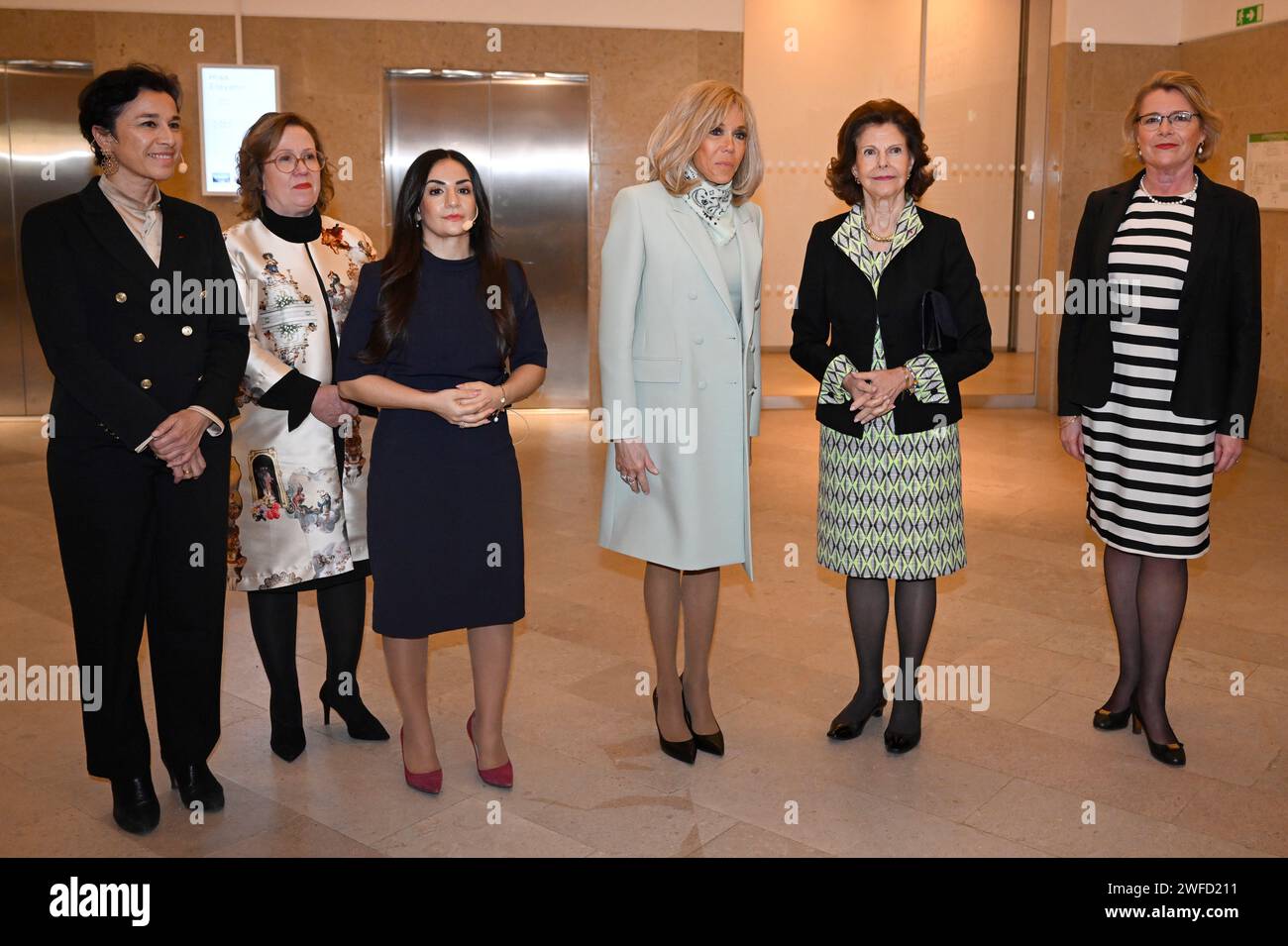 Queen Silvia and Mrs Brigitte Macron pose together with Eva Nguyen Binh ...