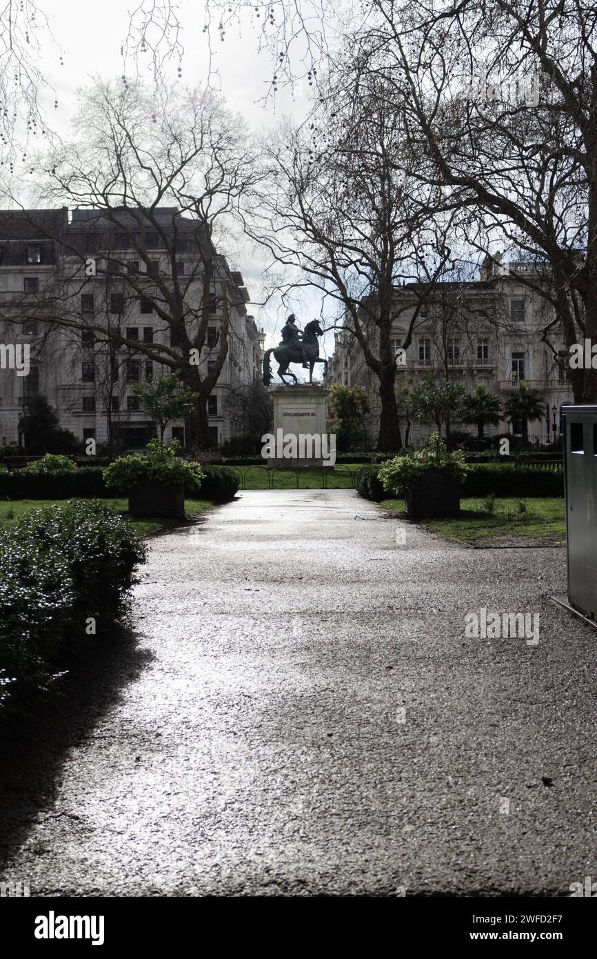 Statue in the middle of St. James's Square in London, UK on a wet ...