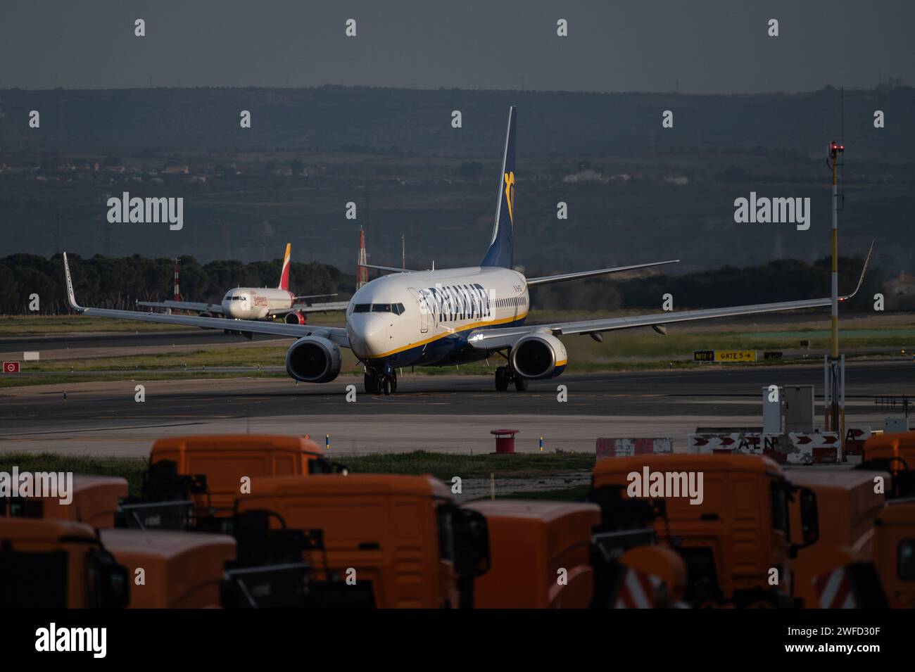 A Ryanair an Iberia Express commercial flights after landing in a ...