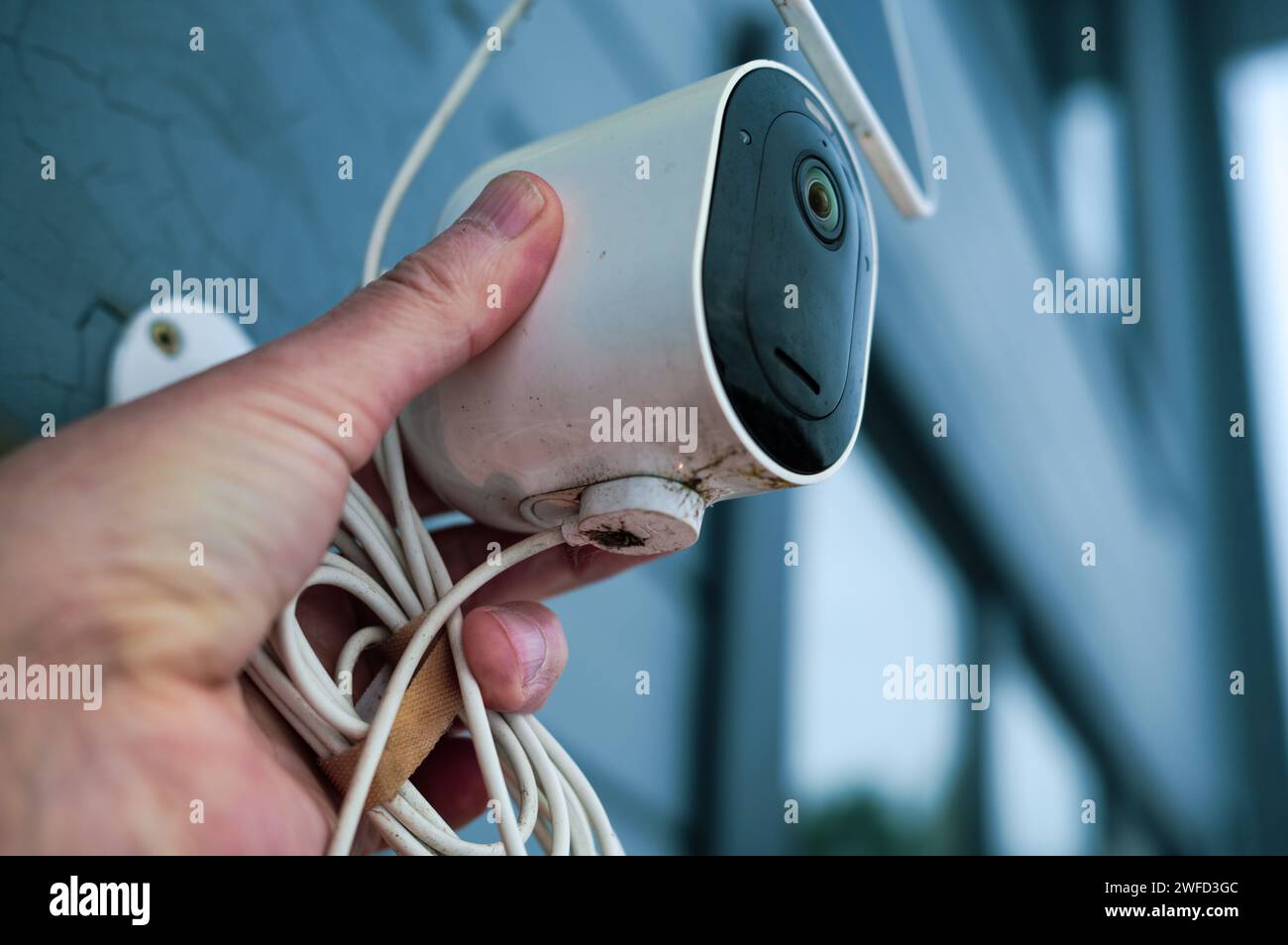 Security surveillance technician adjusting cctv hi-res stock ...