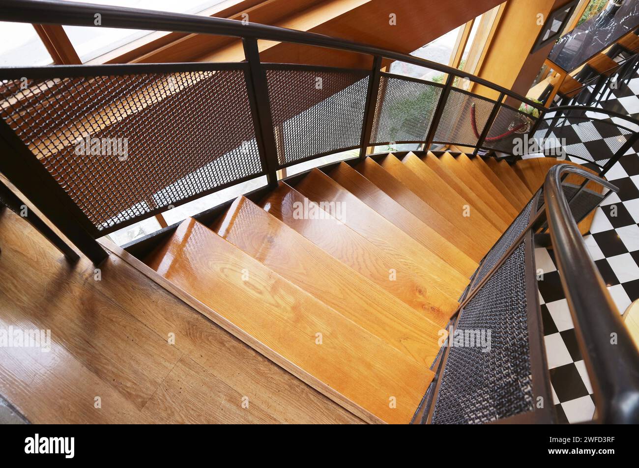 Wooden Curved Staircase Leading to Downstairs Stock Photo - Alamy