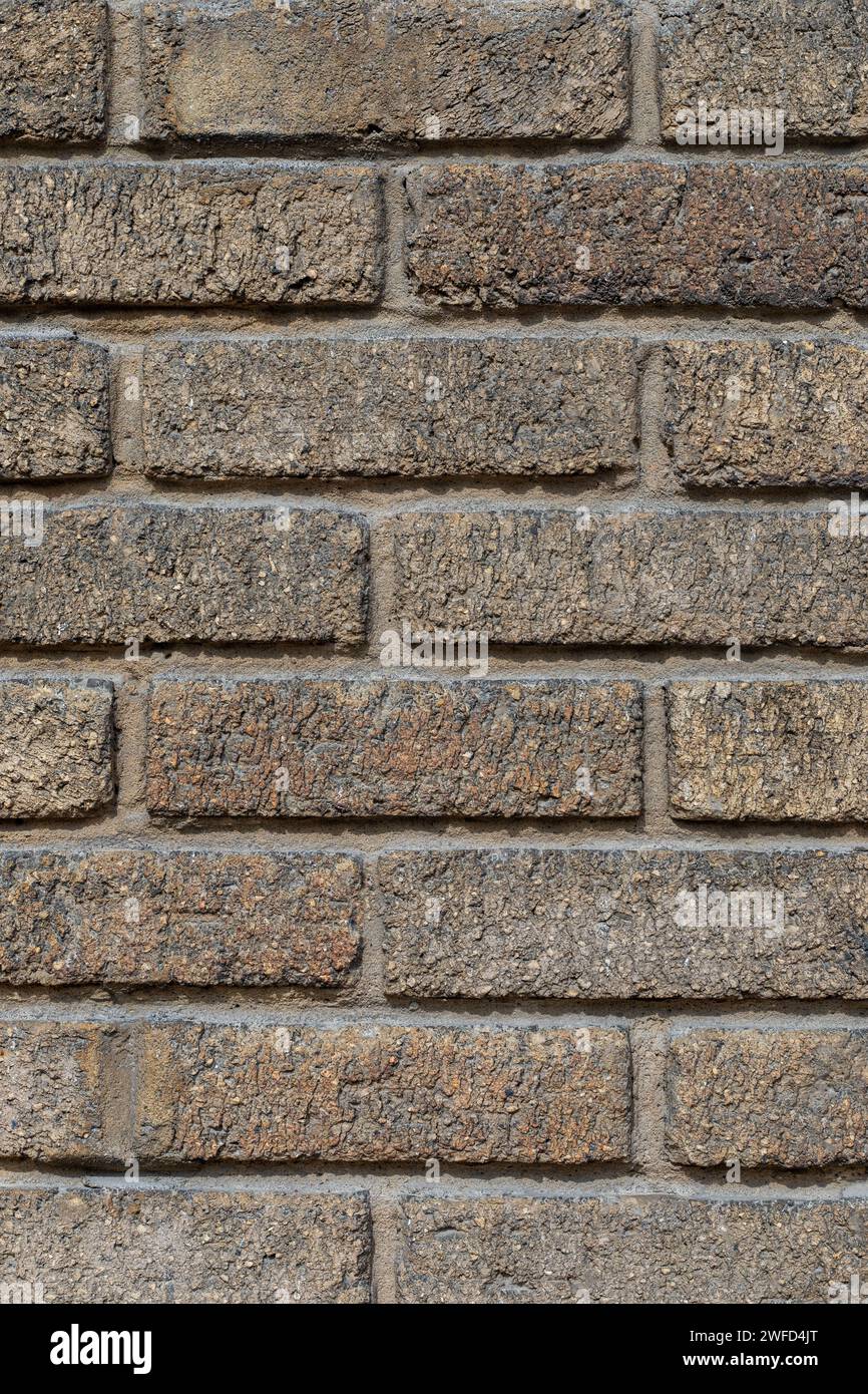 Dark brown brick wall of building. Textured background Stock Photo - Alamy