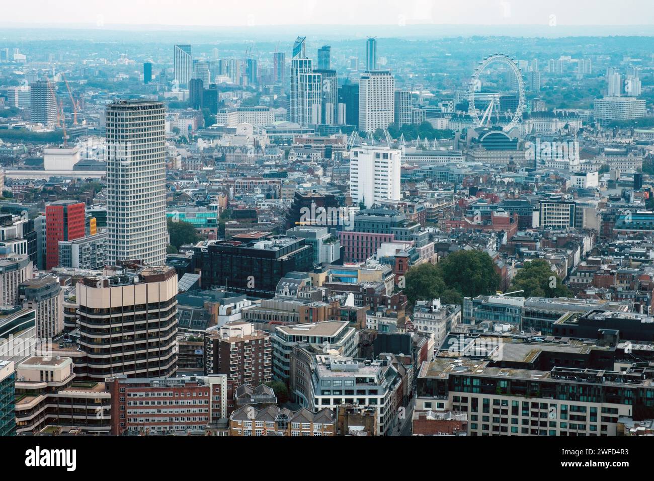 Aerial view dense urban London facing southeast includes London Eye ...