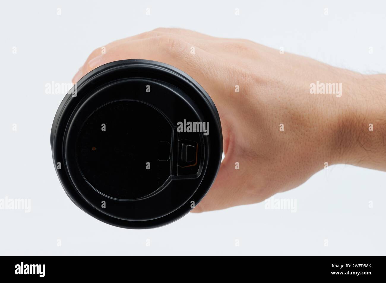Plastic cup with hot lid cover in hand above top view isolated Stock ...