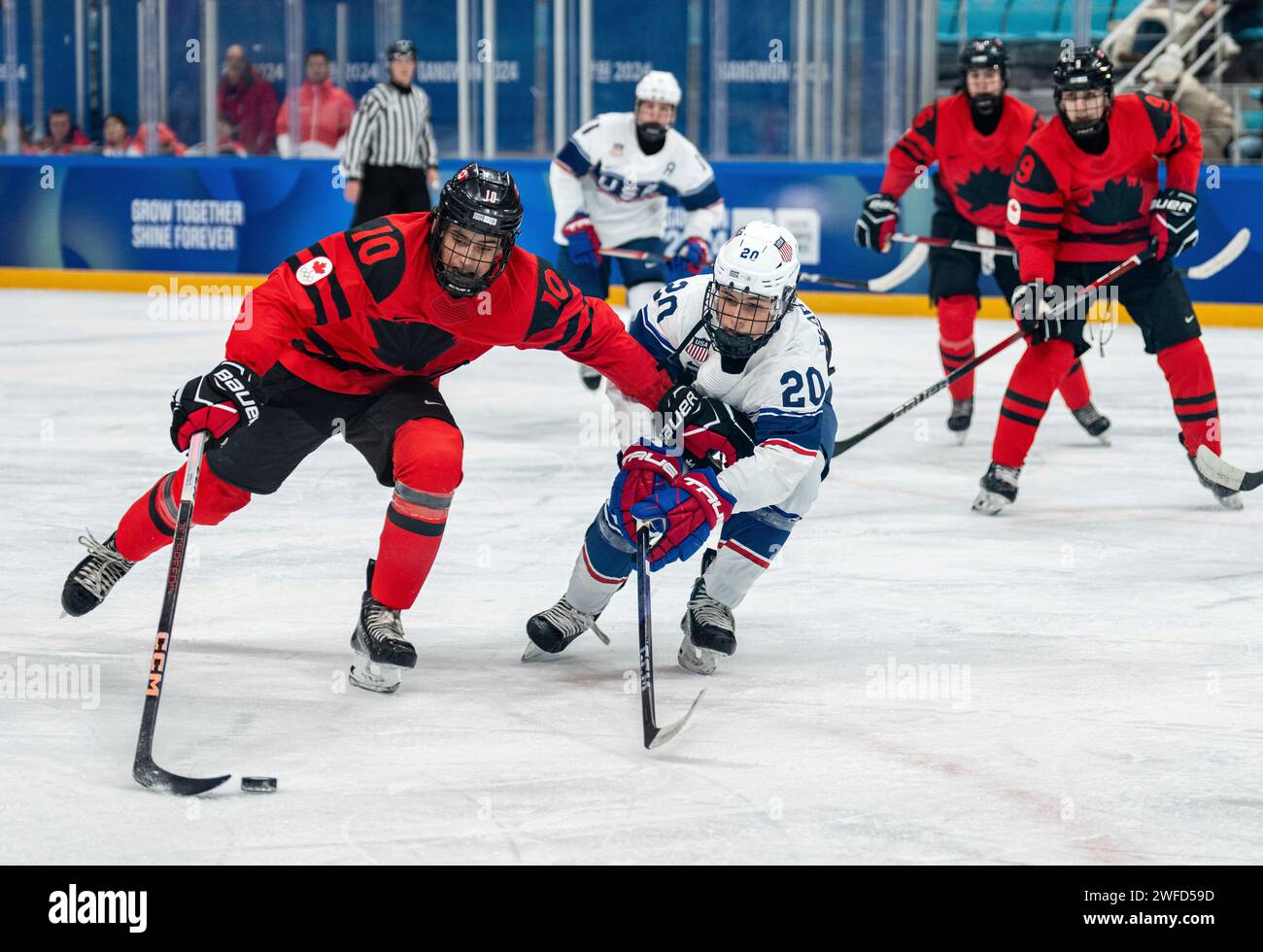 Tyler Martyniuk, of USA, challenges Markus Ruck, of Canada, in the Ice ...