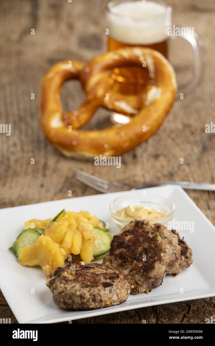 Bavarian Meat Plants With Potato Salad Stock Photo - Alamy