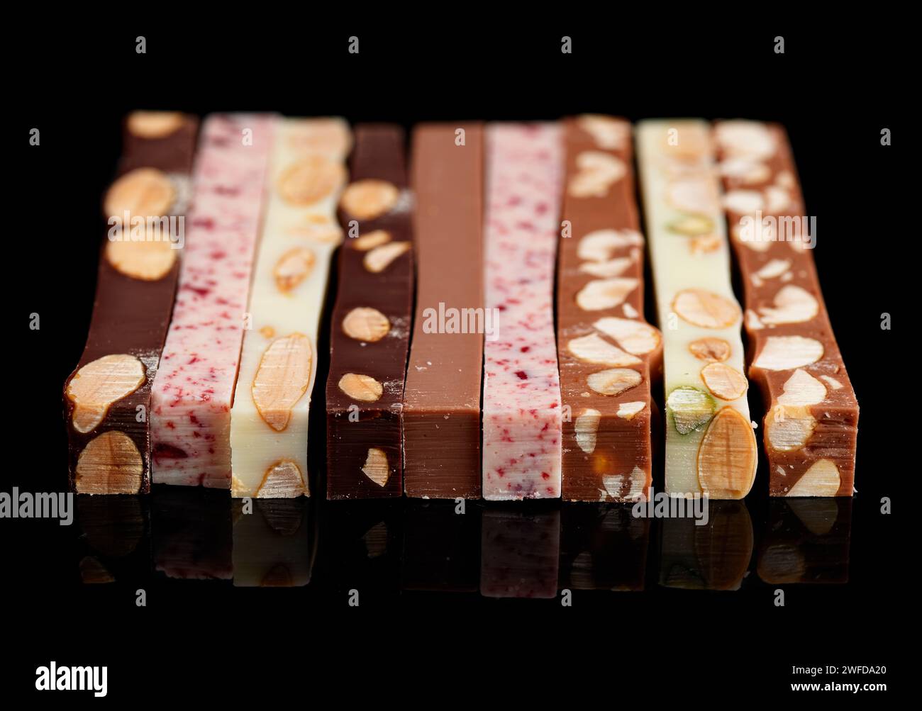 Set of different chocolate bars on black background Stock Photo - Alamy