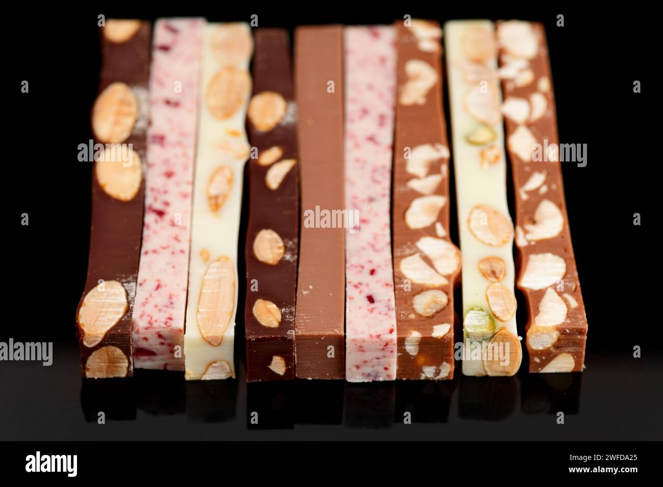 Set of different chocolate bars on black background Stock Photo - Alamy