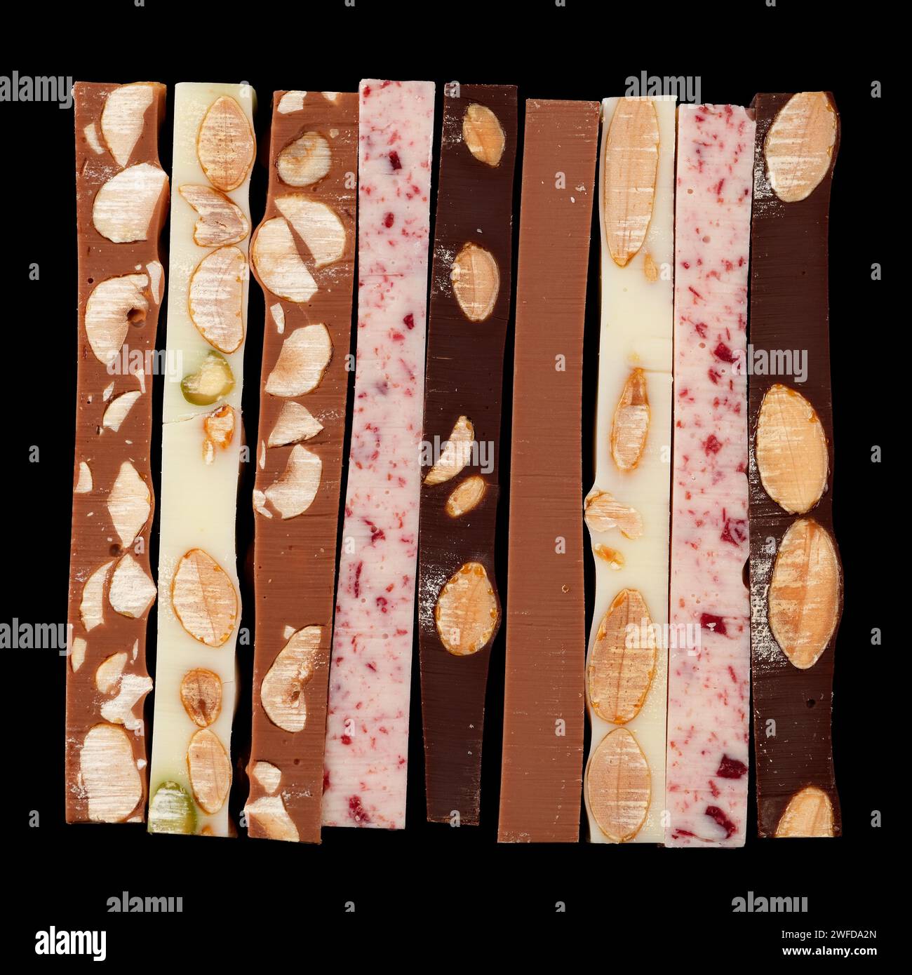 Set of different chocolate bars on black background, shot from above ...