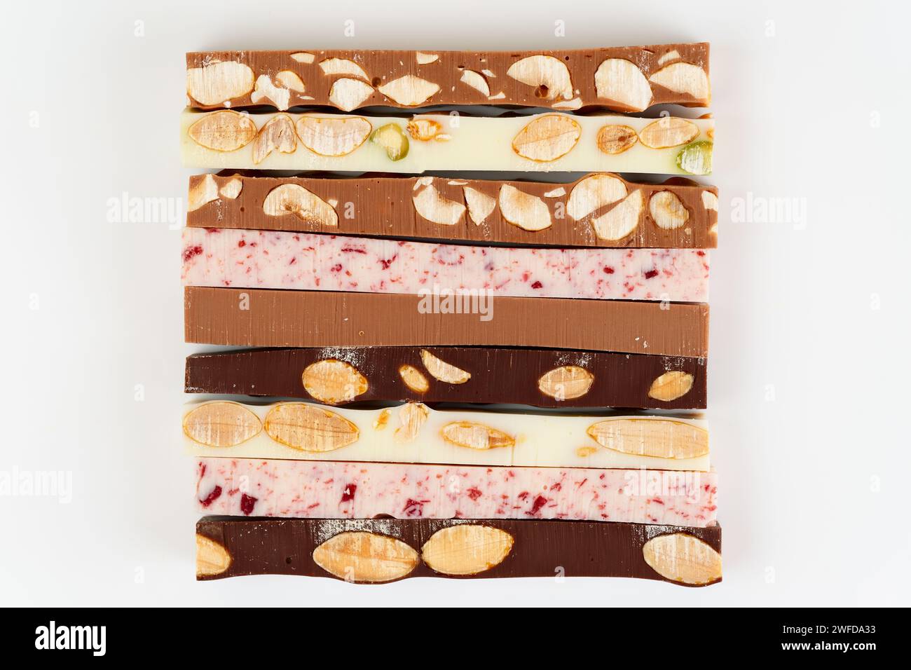 Set of different chocolate bars on white background, shot from above ...
