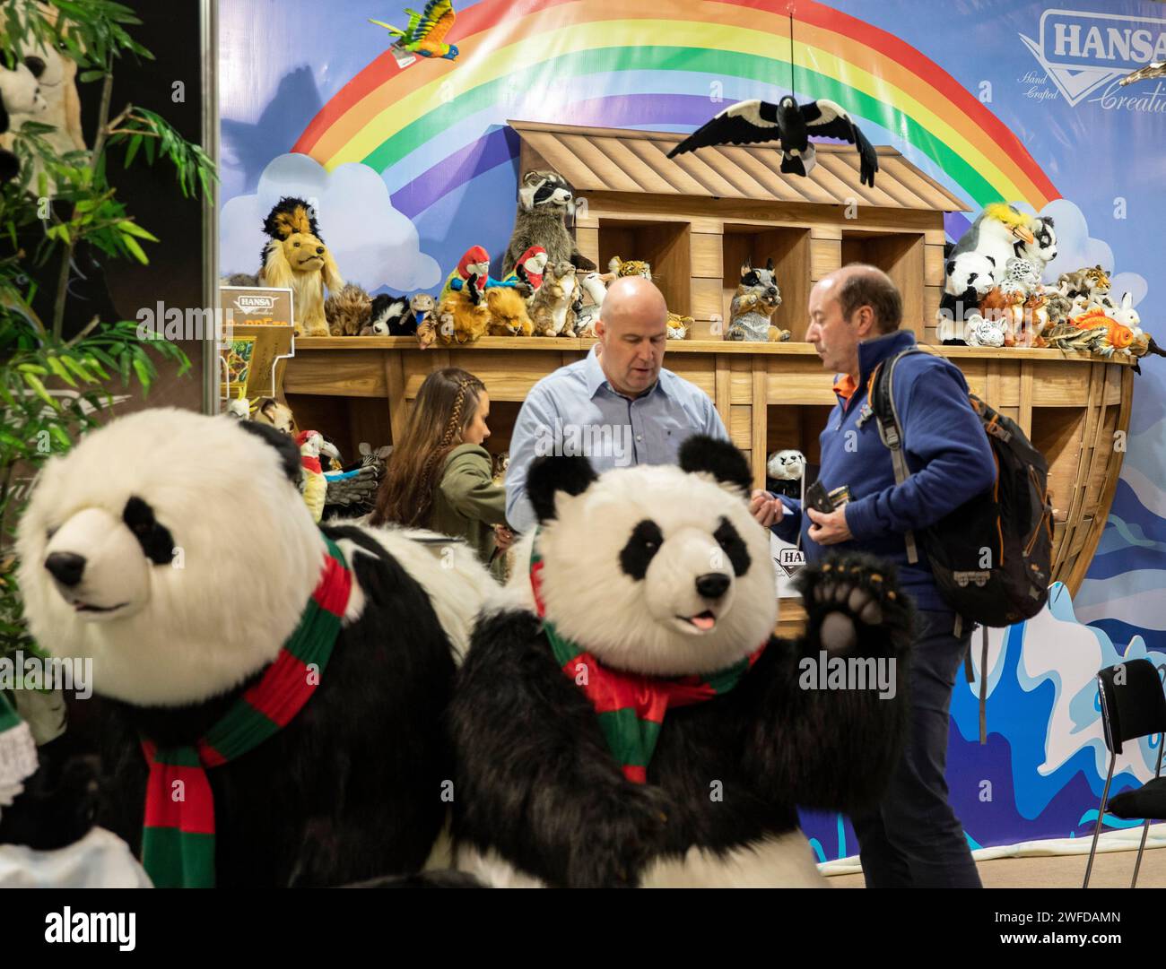 Nuremberg, Germany. 30th Jan, 2024. People talk behind panda models at ...