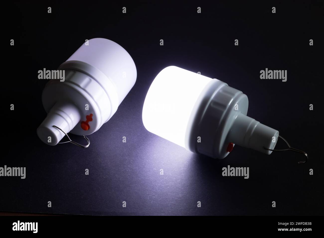 Two white emergency led bulbs with integrated battery Stock Photo - Alamy