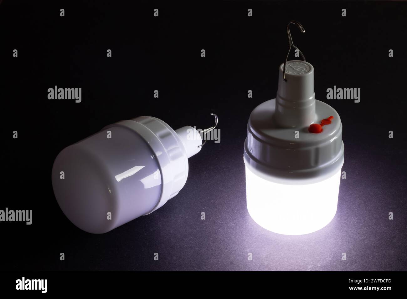 Two white emergency led bulbs with integrated battery Stock Photo - Alamy