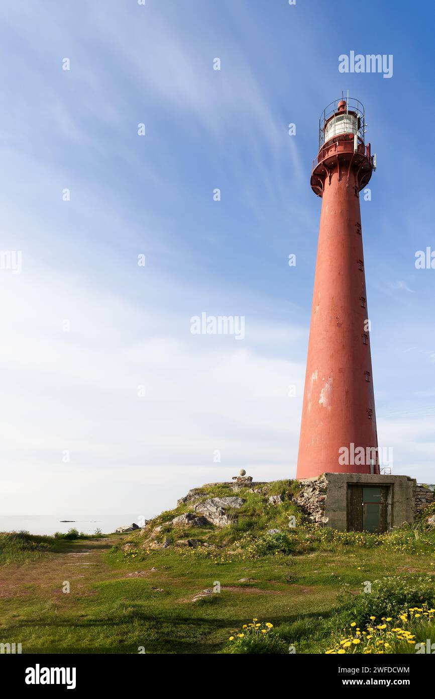 A vertical view of Andenes Lighthouse amid a blossoming summer ...