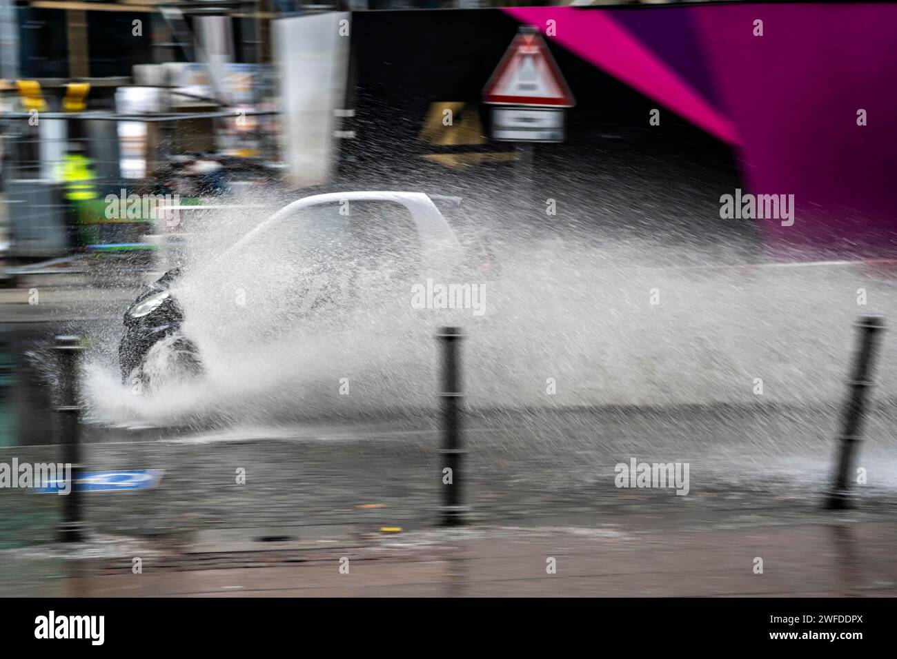 Winter, rainy weather, freezing rain, large puddle, puddle of water, in ...