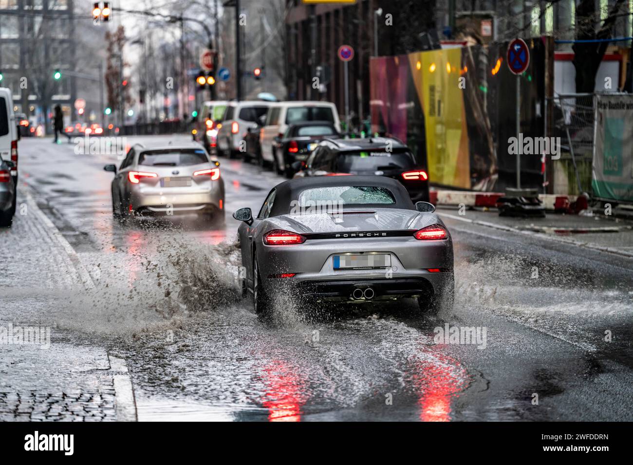 Winter, rainy weather, freezing rain, large puddle, puddle of water, in ...