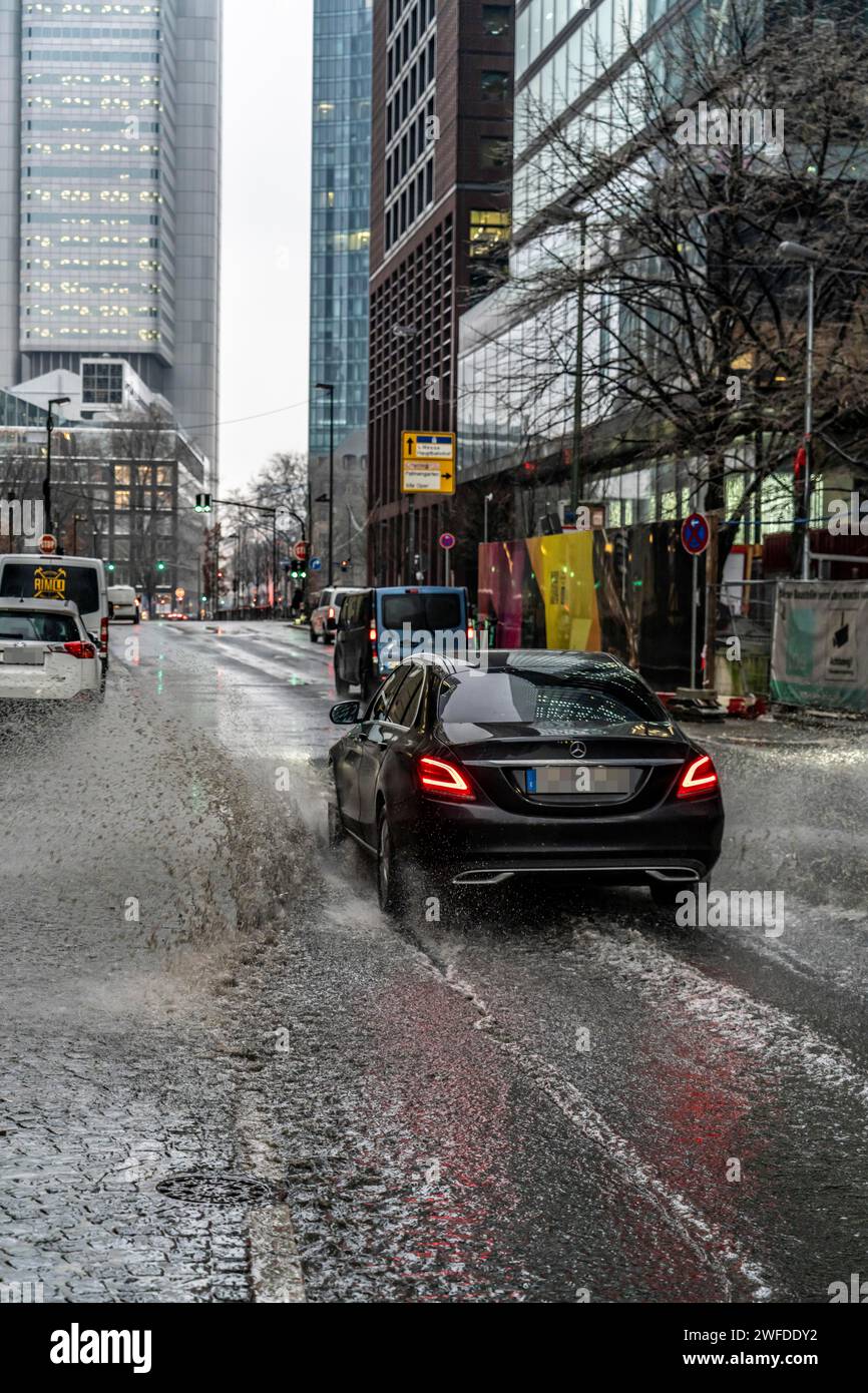 Winter, rainy weather, freezing rain, large puddle, puddle of water, in ...