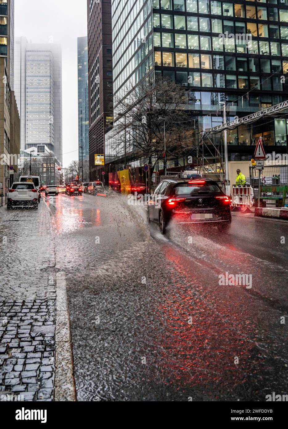 Winter, rainy weather, freezing rain, large puddle, puddle of water, in ...