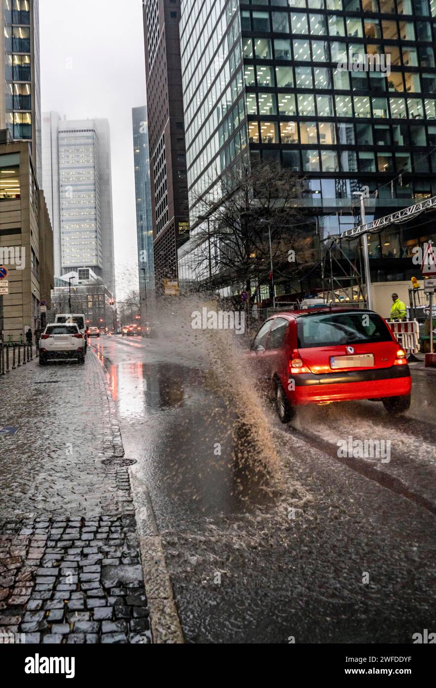 Winter, rainy weather, freezing rain, large puddle, puddle of water, in ...