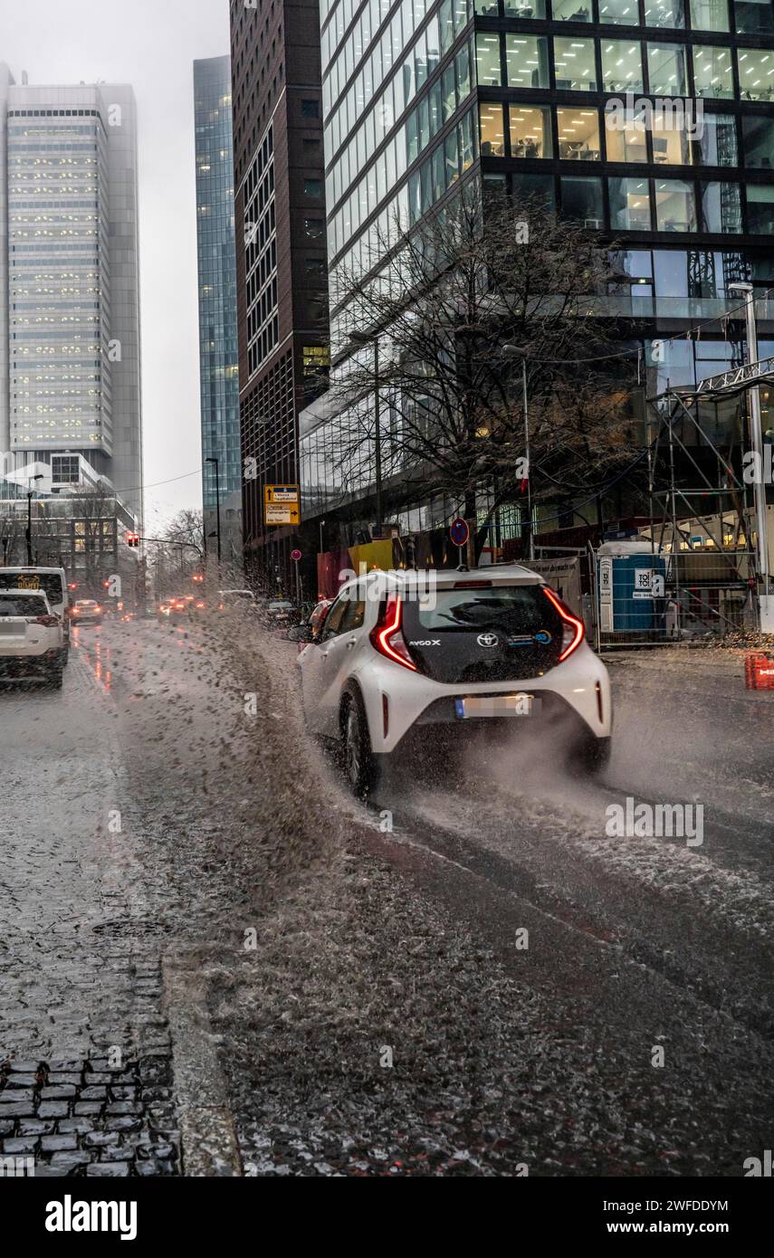 Winter, rainy weather, freezing rain, large puddle, puddle of water, in ...