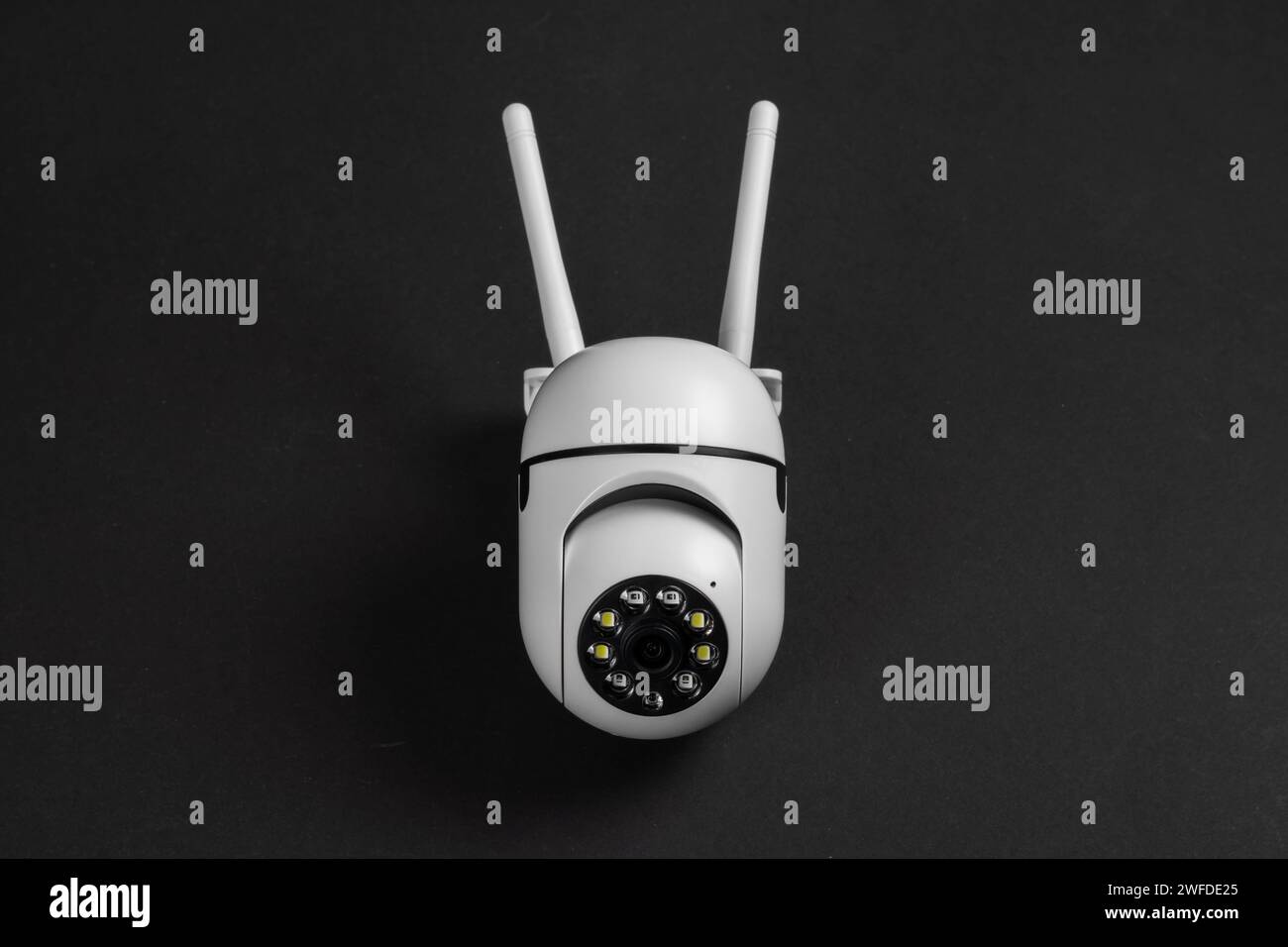 Modern outdoor wi-fi CCTV camera on dark background close up Stock ...