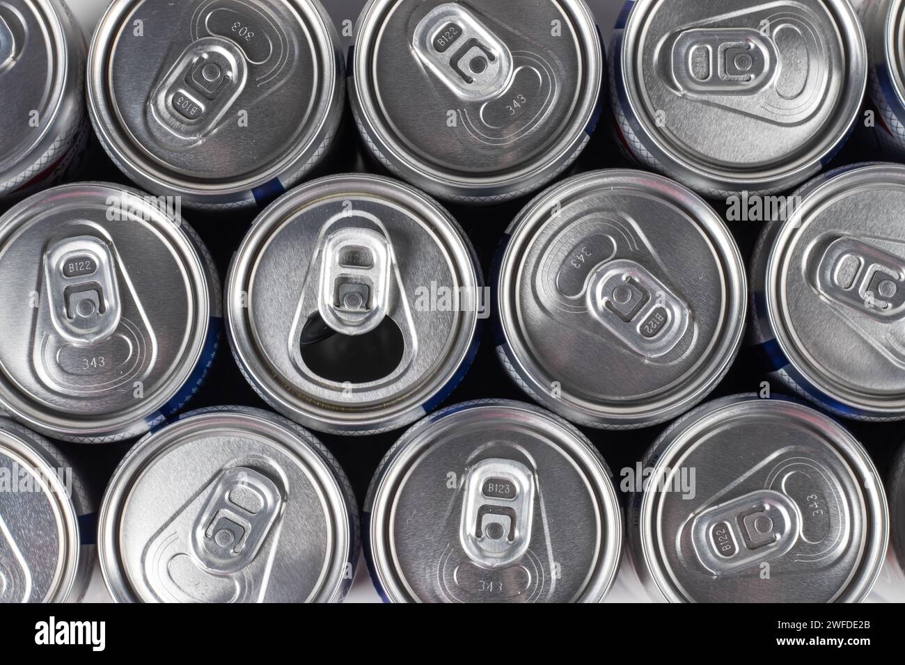 metal beer cans background, one can is open. top view Stock Photo - Alamy