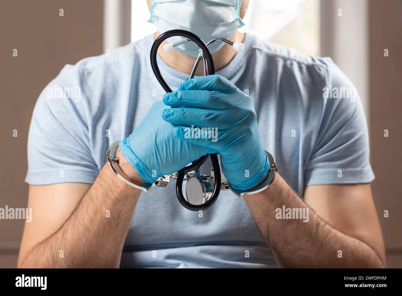 With handcuffs and in uniform hi-res stock photography and images - Alamy