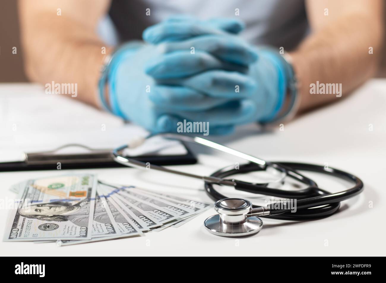 Doctor with handcuffs and money. Medical crime Stock Photo - Alamy