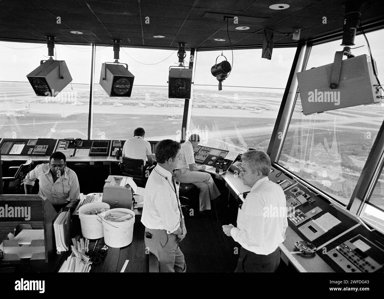 Air traffic controllers monitor conditions from the ground control ...