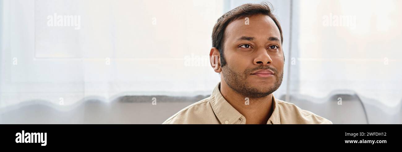 handsome indian man with visual impairment in cozy clothing sitting on ...