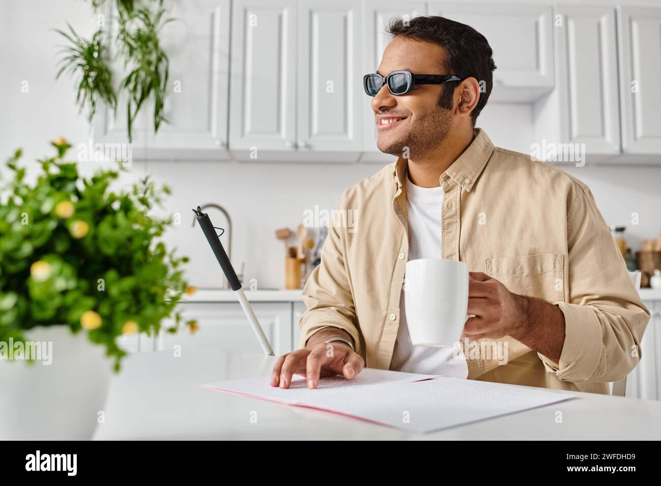 joyous blind indian man in casual attire with coffee and walking stick ...