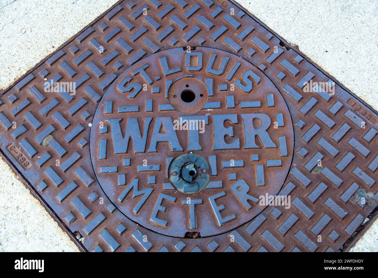 Cast iron water meter cover in St. Louis, Missouri Stock Photo - Alamy