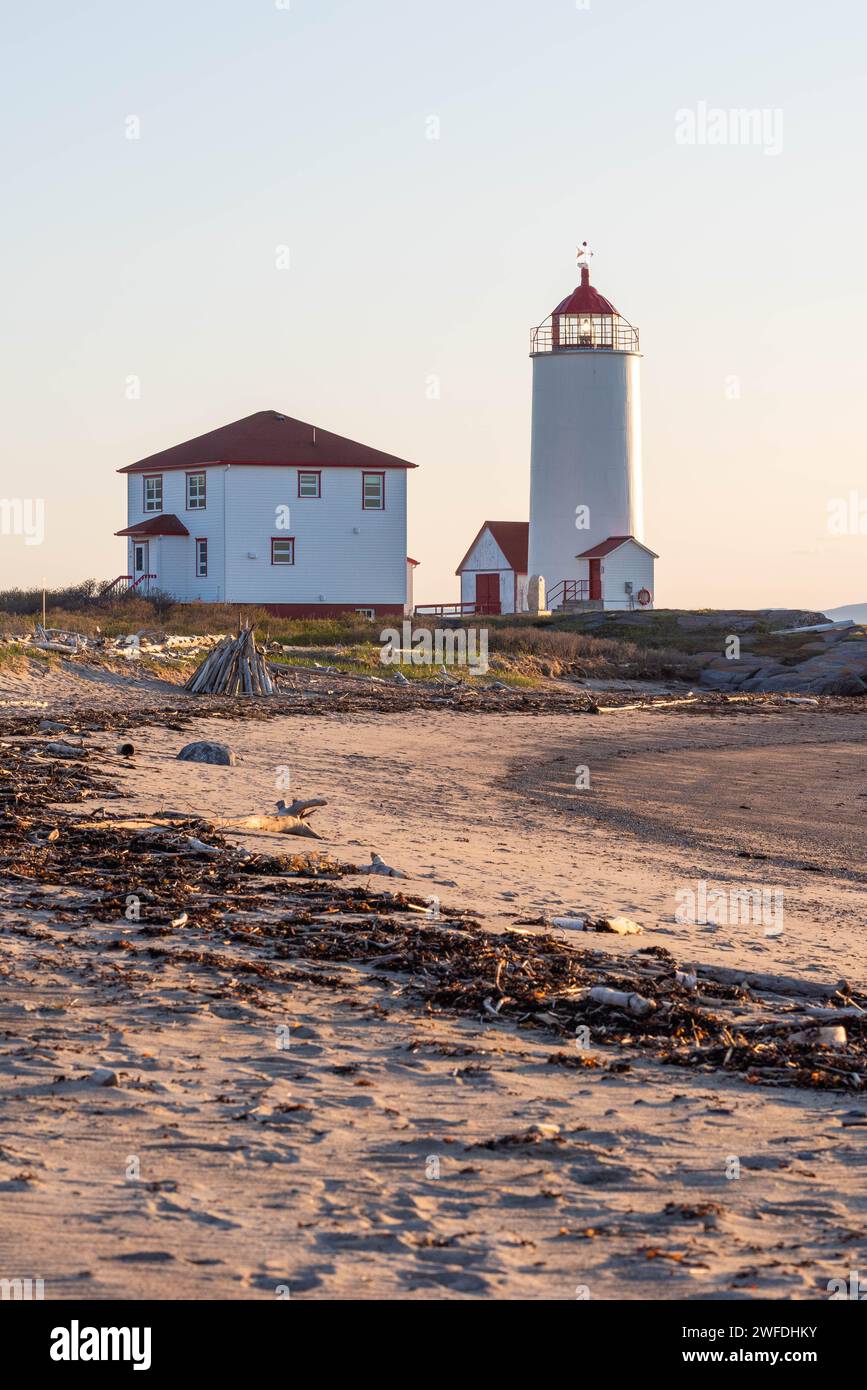 At the sunset the lighthouse of L’Isle-Verte with the beach in ...