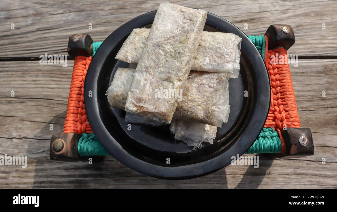 Traditional Andhra sweet Pootharekulu made from paper thin sheet made ...