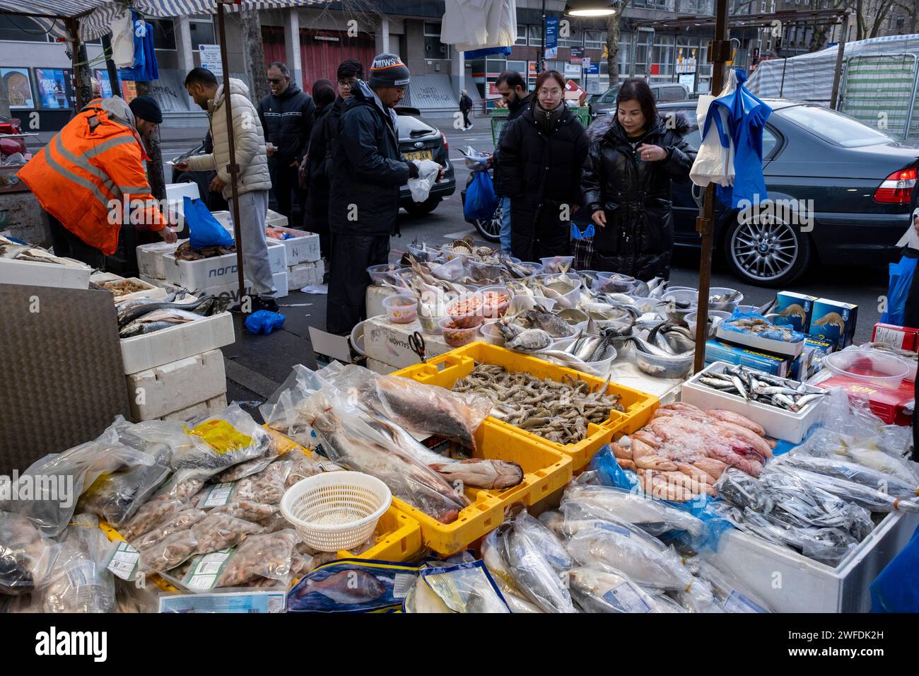 Diverse community street scene at a Whitechapel Market fish stall on ...