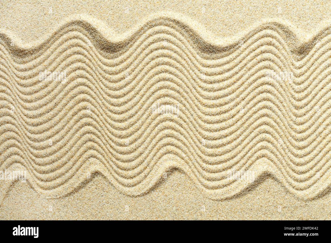 Wave patern in brown sand Stock Photo - Alamy