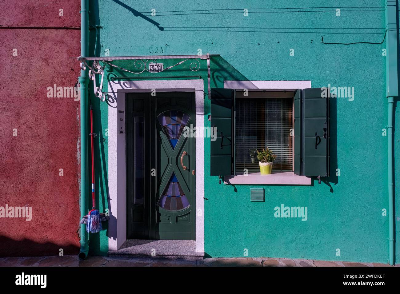 The colorful entrances to houses on the island of Burano near venice ...