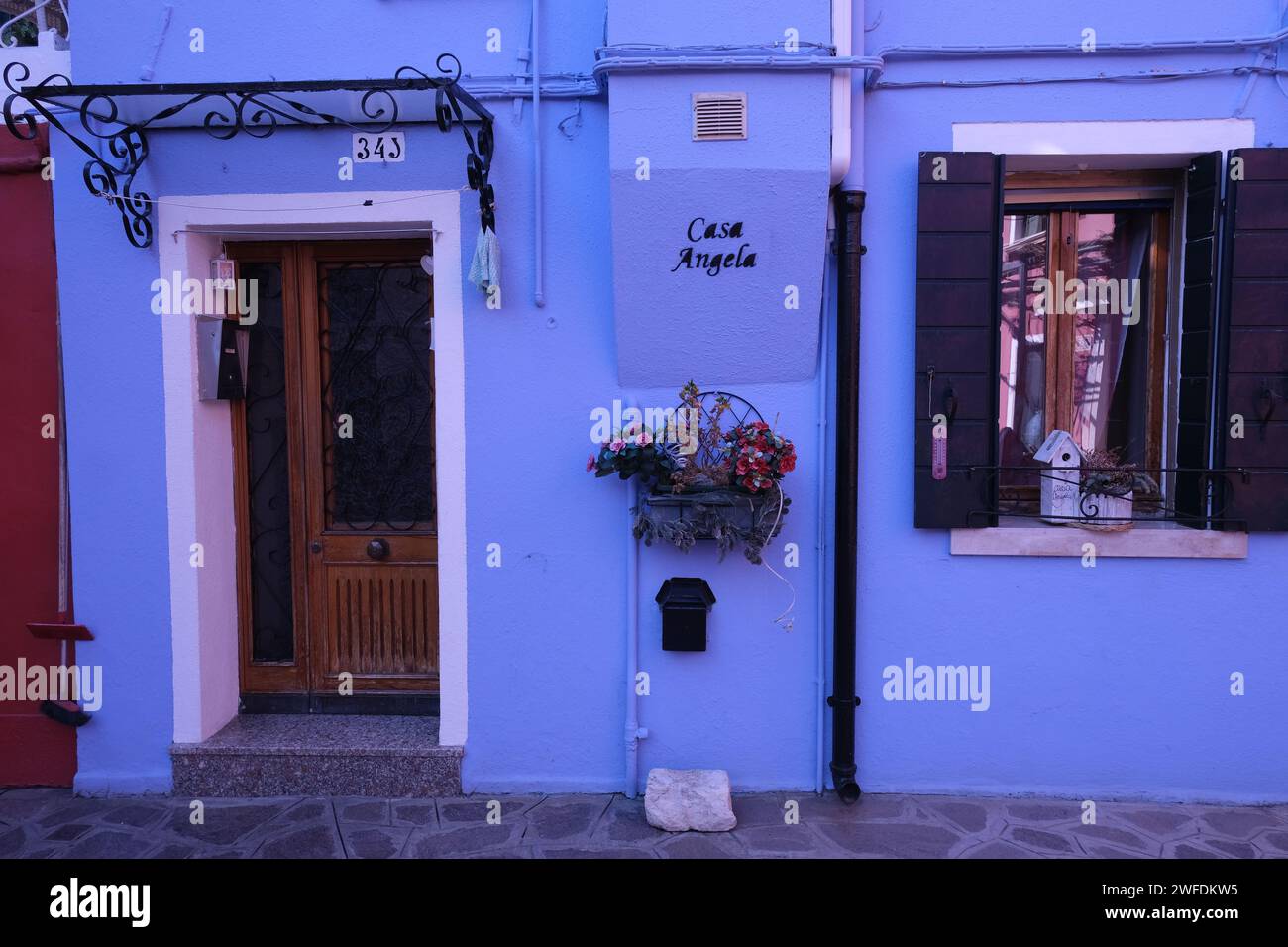 The colorful entrances to houses on the island of Burano near venice ...