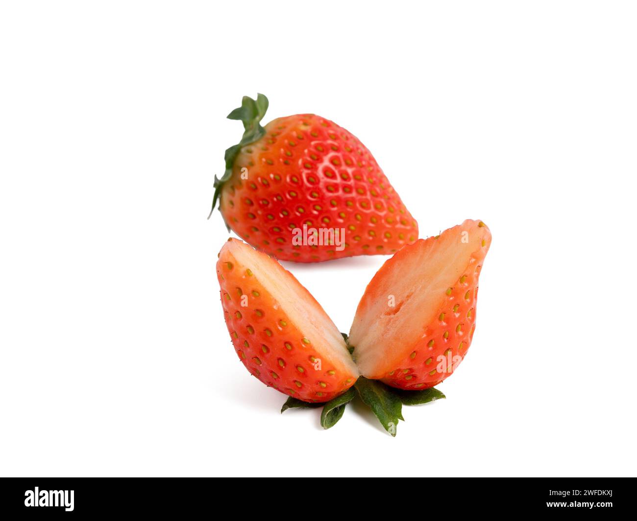 Strawberries cut in half on a white background. Strawberries close up ...
