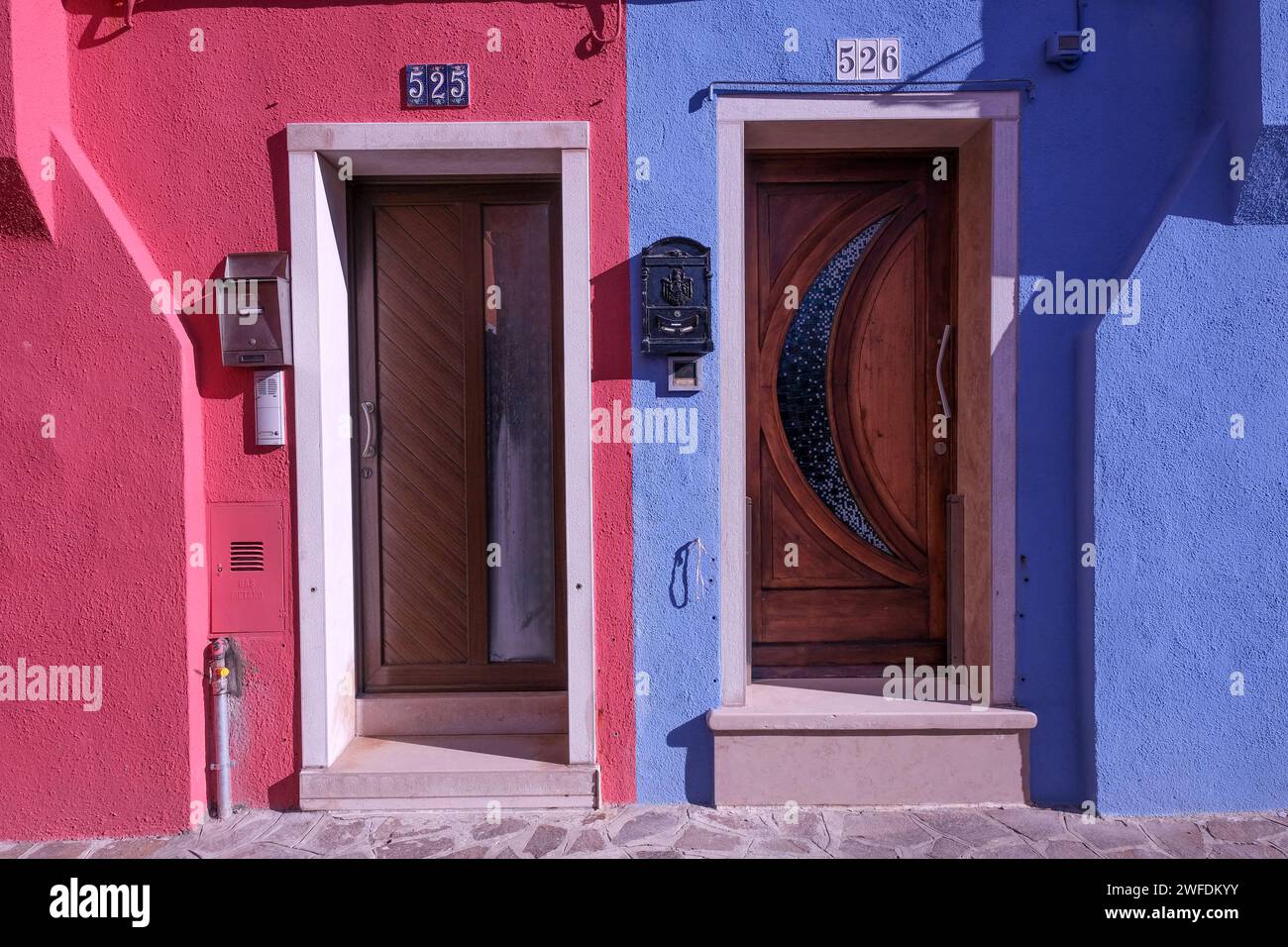The colorful entrances to houses on the island of Burano near venice ...