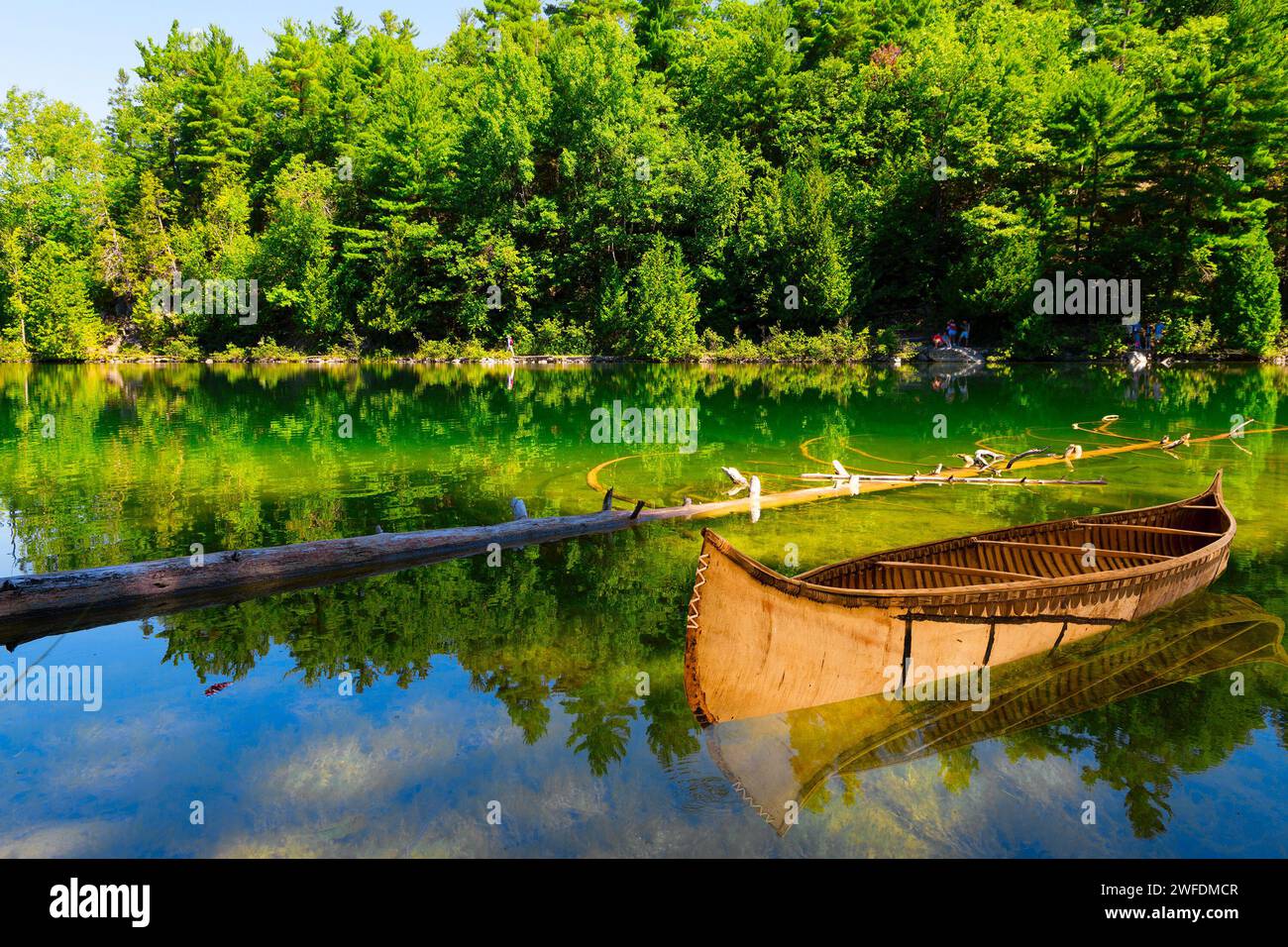 A homemade Indian kayak made of thin wood stands on a quiet lake Stock ...