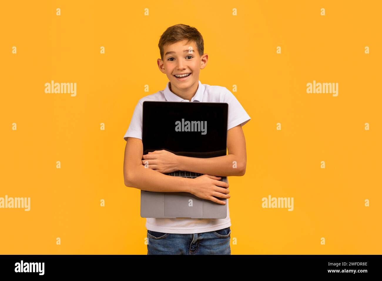 Tech Lover Concept. Cheerful Teen Boy Hugging Laptop With Blank Screen ...