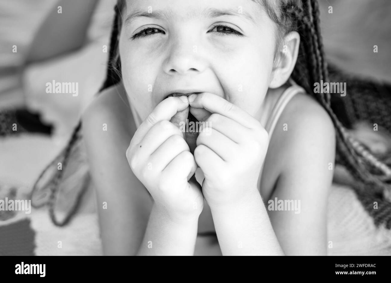 Kids teeth. Smiling girl holding missing tooth. Funny face close up ...