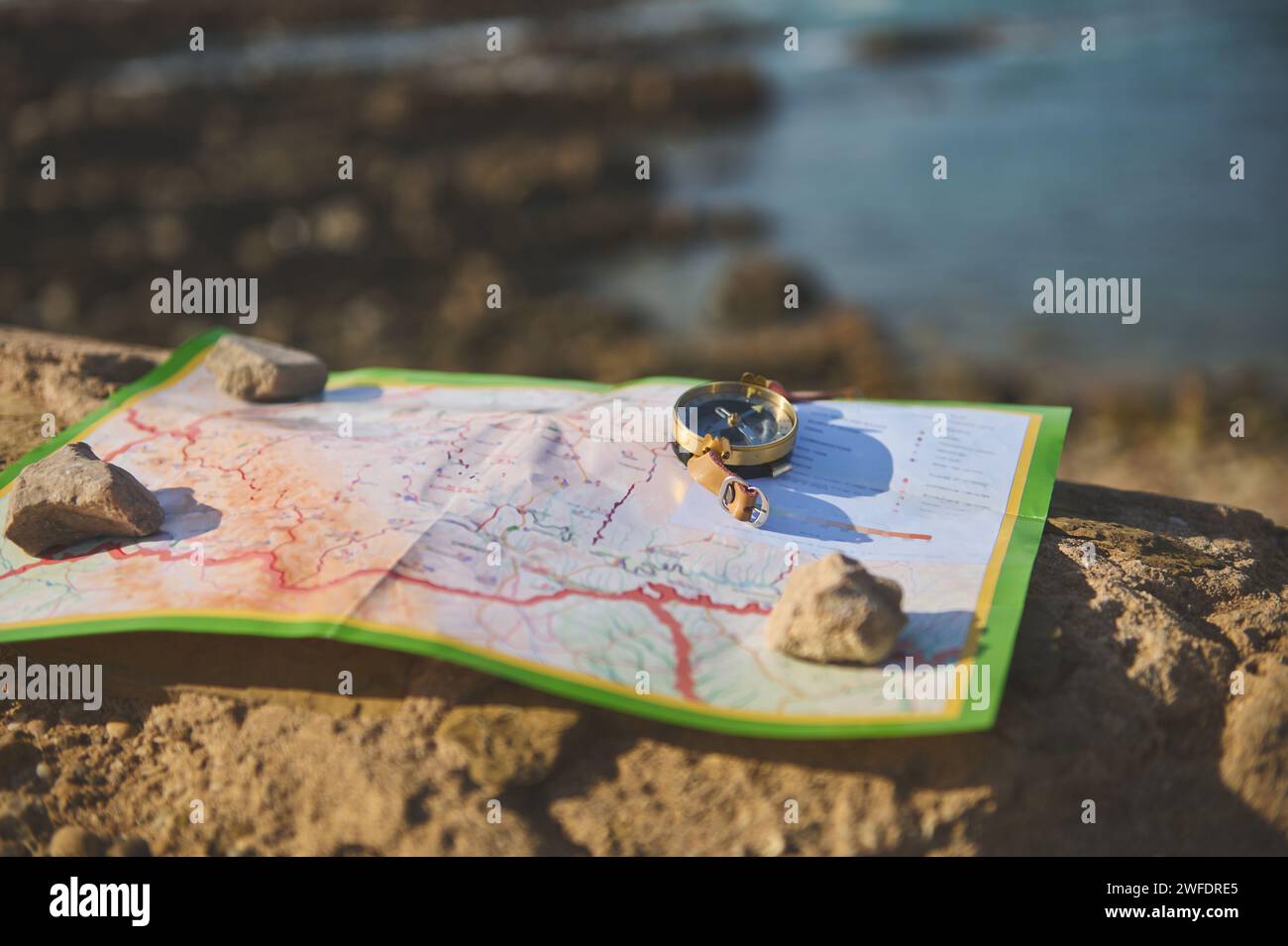 Still life with geographic map and old golden compass with a magnetic ...